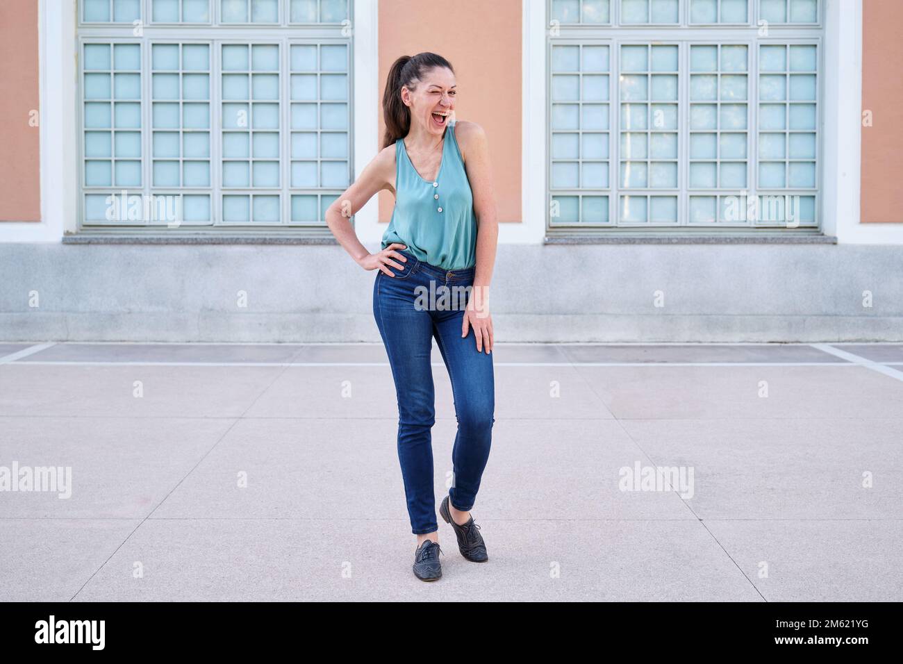 Woman winking and smiling hi-res stock photography and images - Alamy