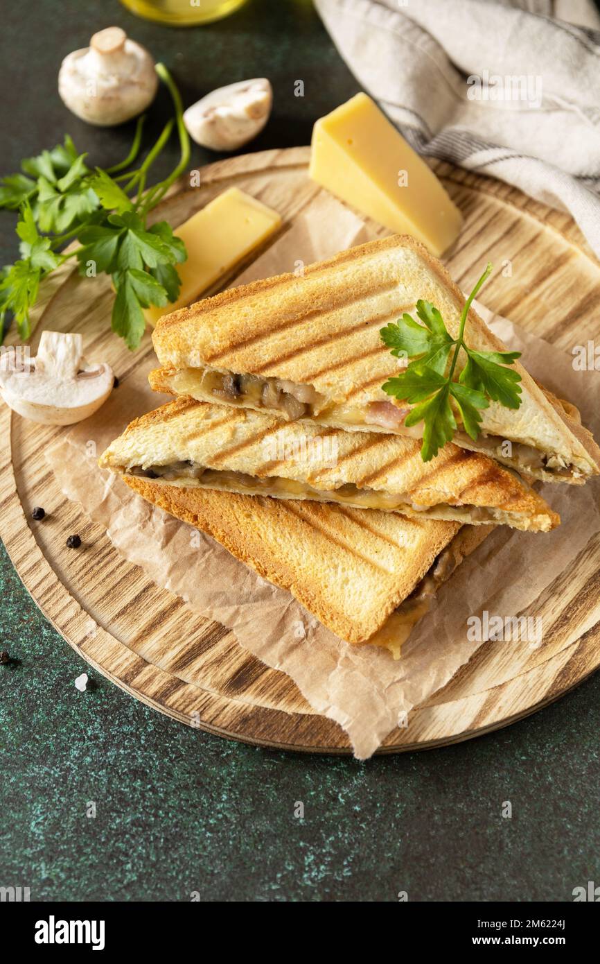 Delicious sandwich with grilled cheese, bacon and mushroom. Homemade ...