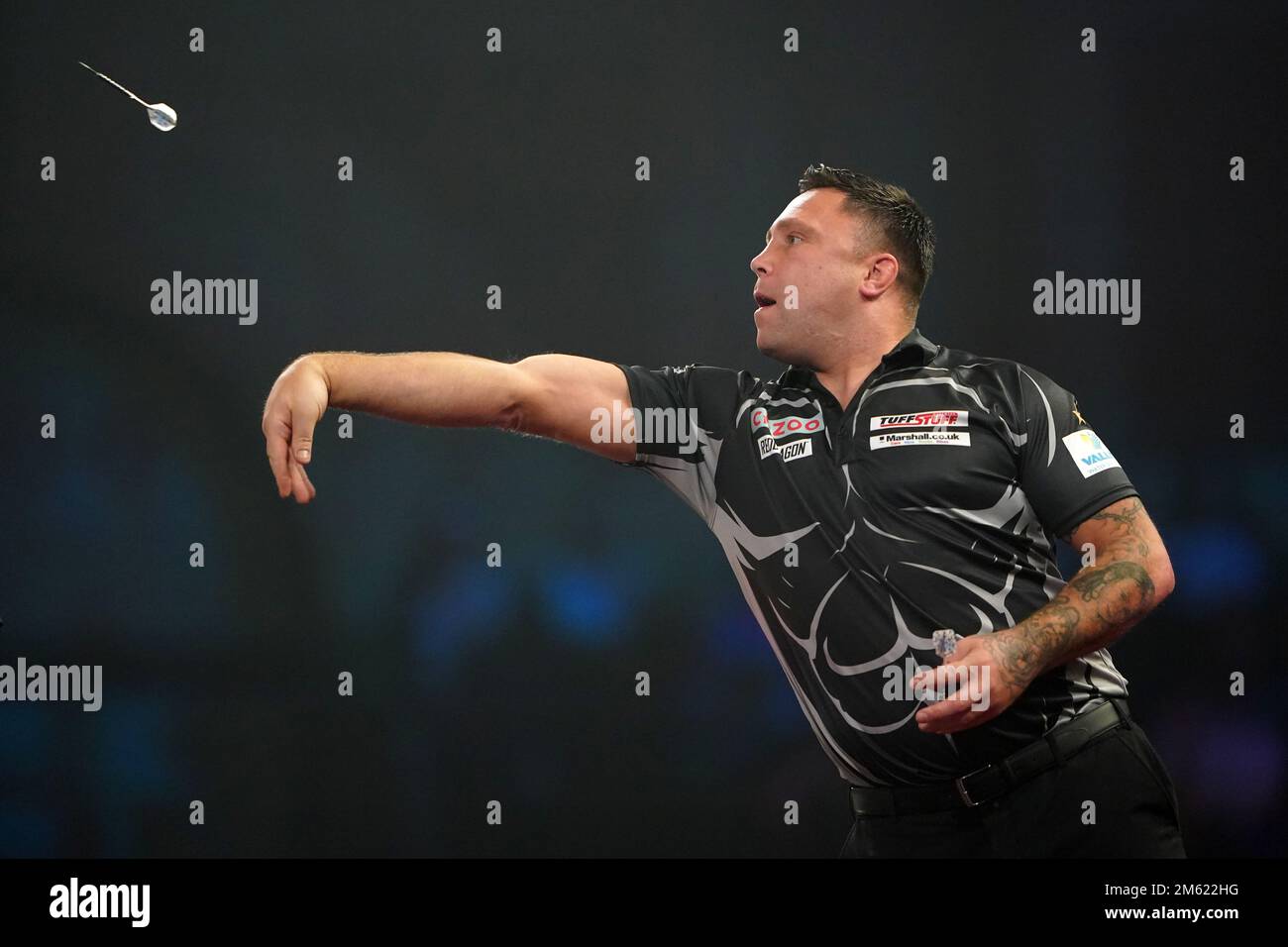 Gerwyn Price in action against Gabriel Clemens during day fourteen of ...
