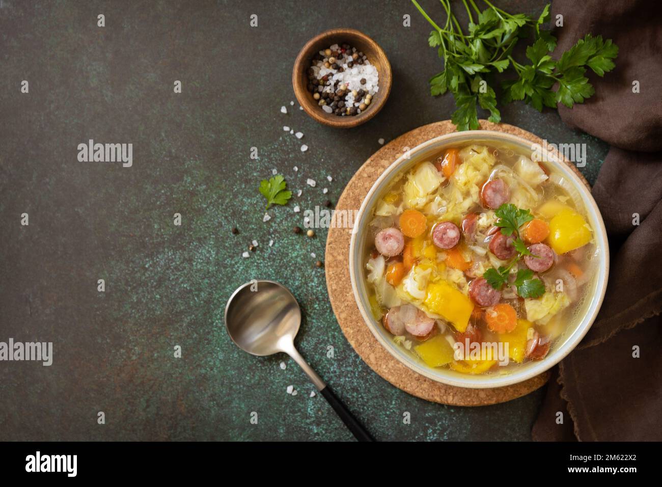 Traditional Zelnacka cabbage soup with sausages and vegetables in a ...
