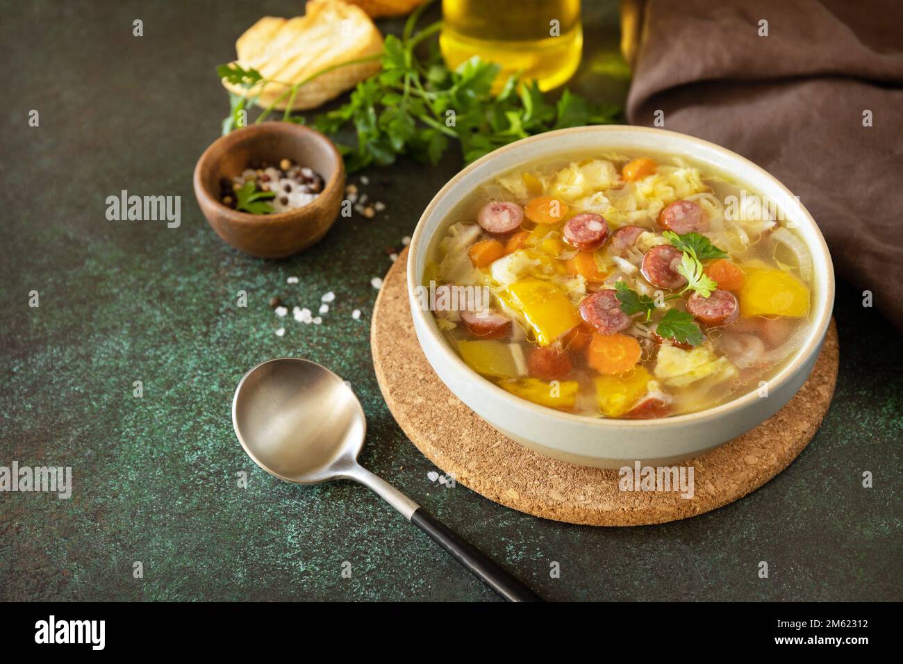 Traditional Zelnacka cabbage soup with sausages and vegetables in a ...