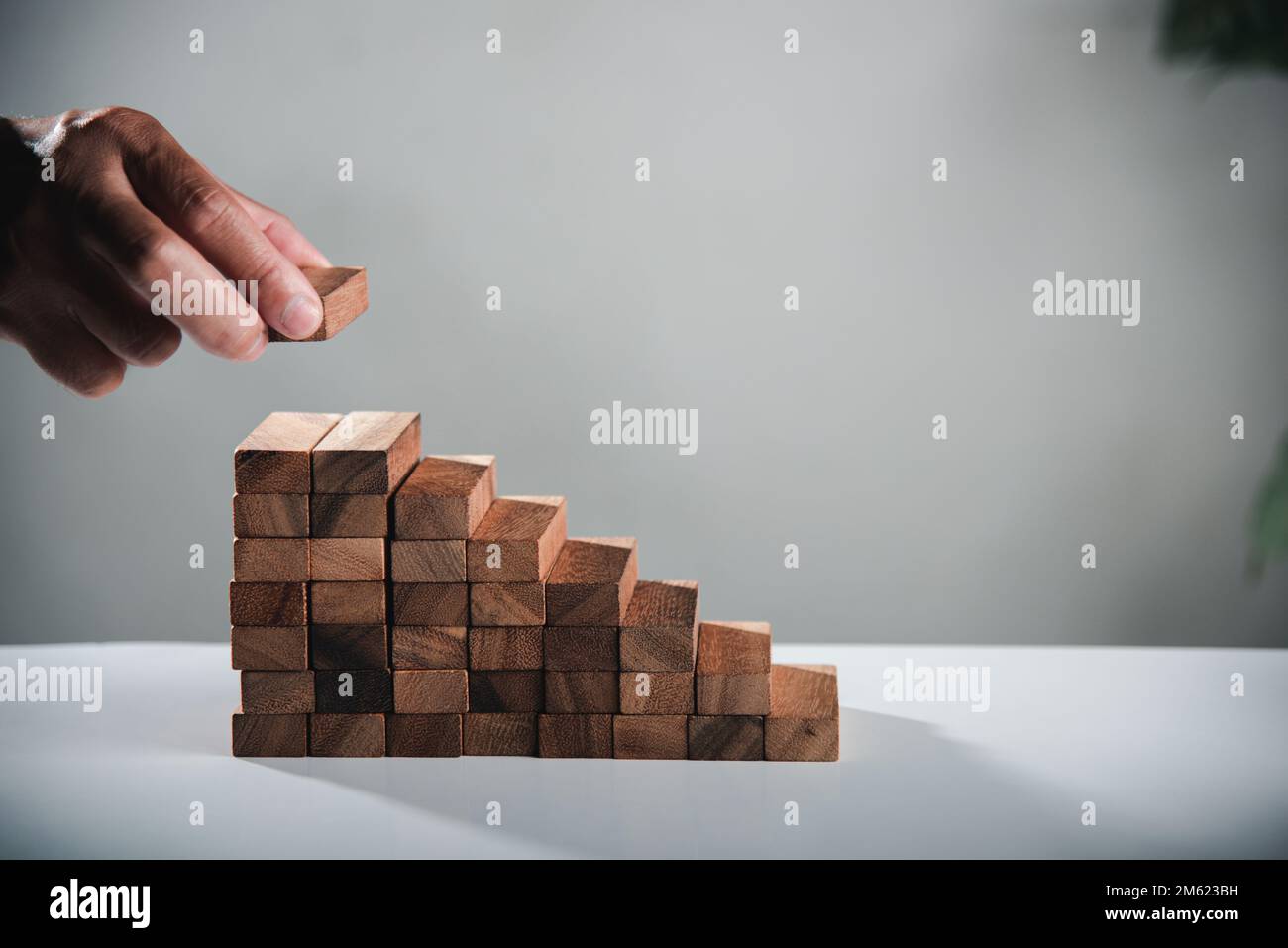 Business hand arranging put wooden block stacking step stair growth ...