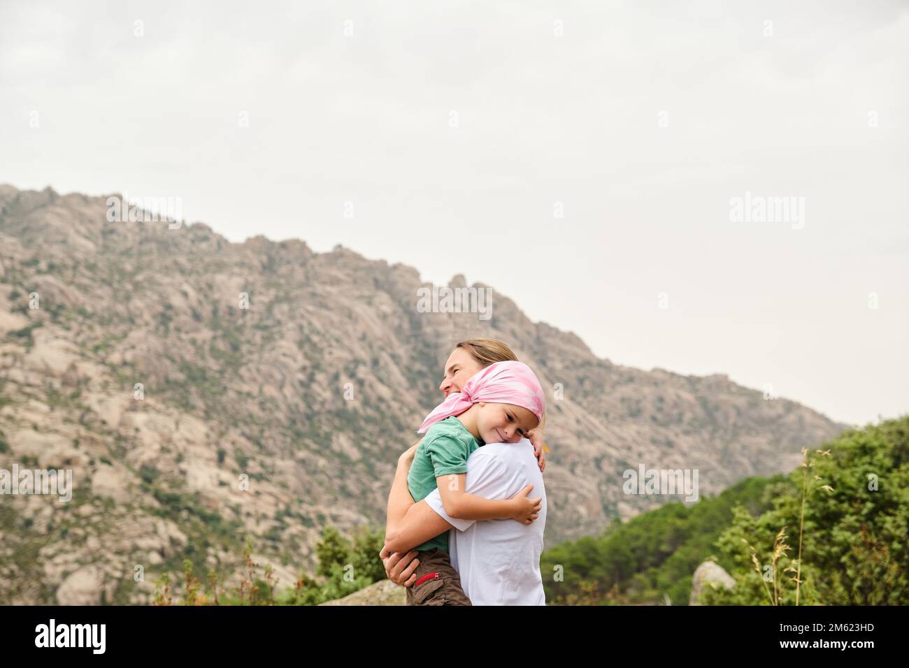 Mother and child embracing in nature. Cancer concept Stock Photo - Alamy