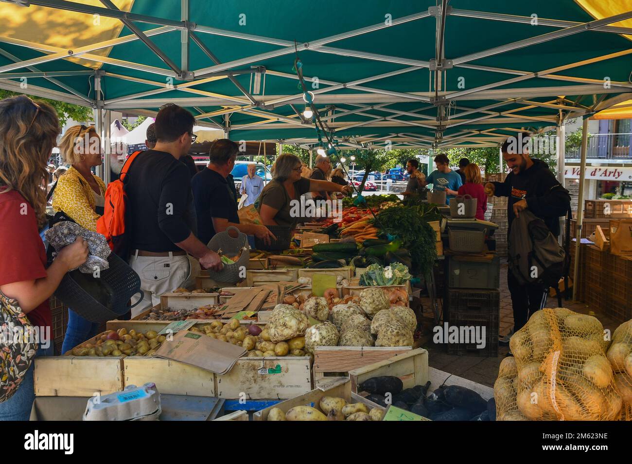 Locals and tourists shopping at a fruit and vegetable stall of the ...