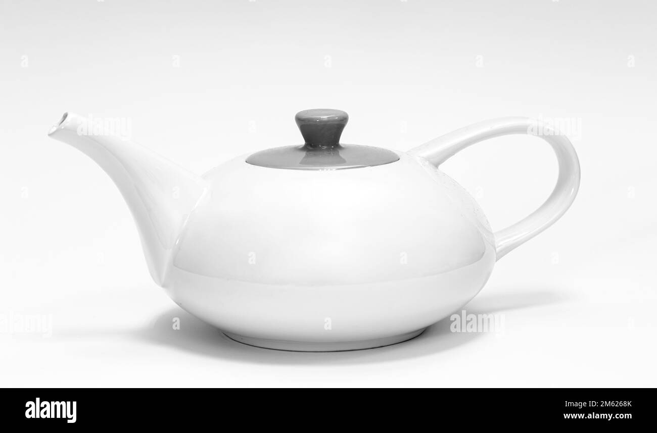 White teapot close-up on a white background isolated Stock Photo - Alamy