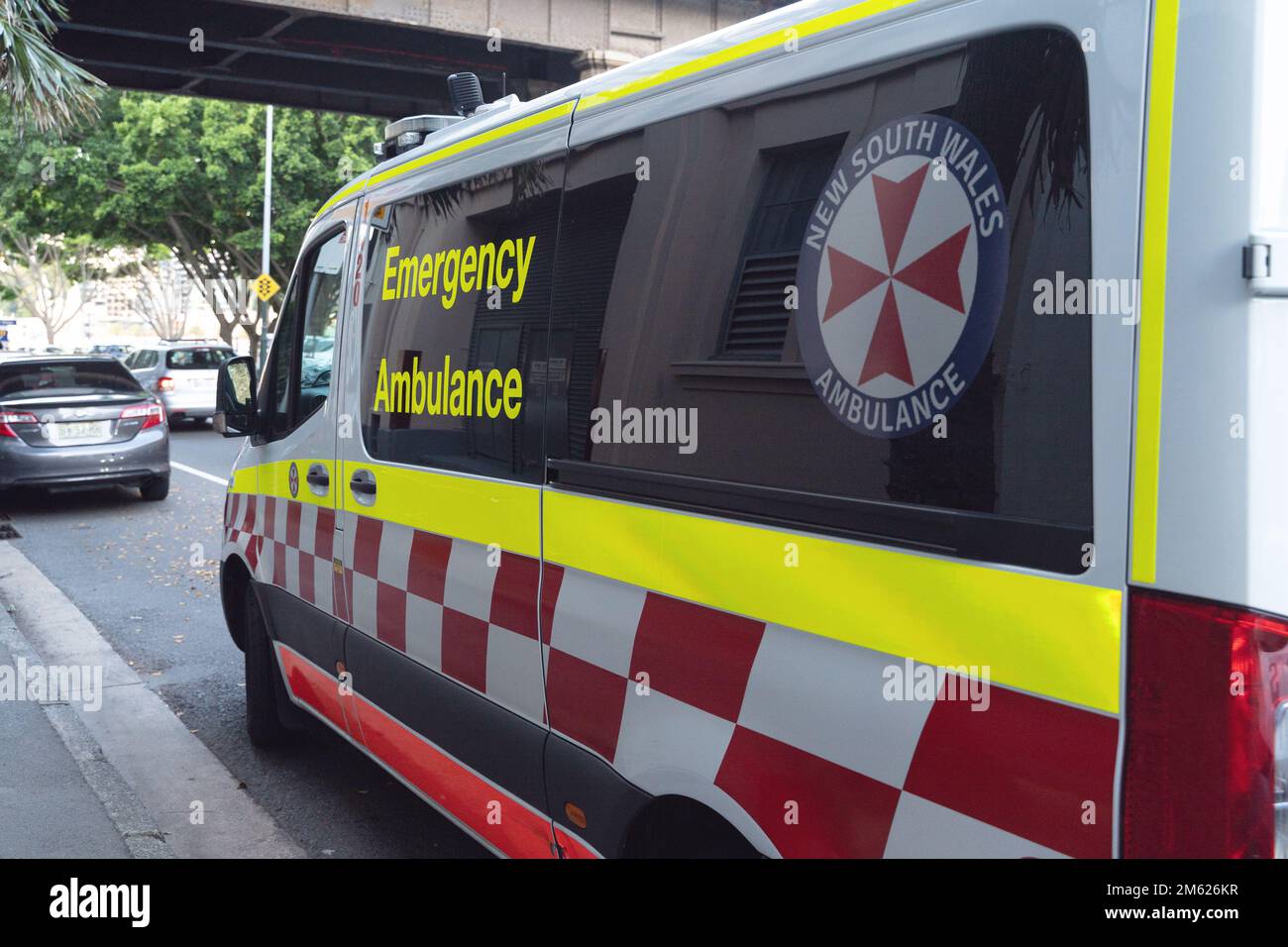 Emergency Ambulance arrives at an apartment building to attend to a ...