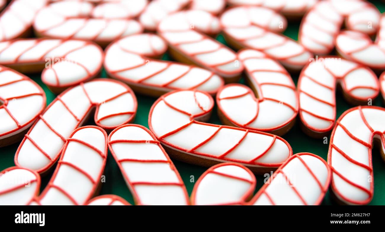 A lot of gingerbread candy cane shaped cookies, flat lay Stock Photo ...