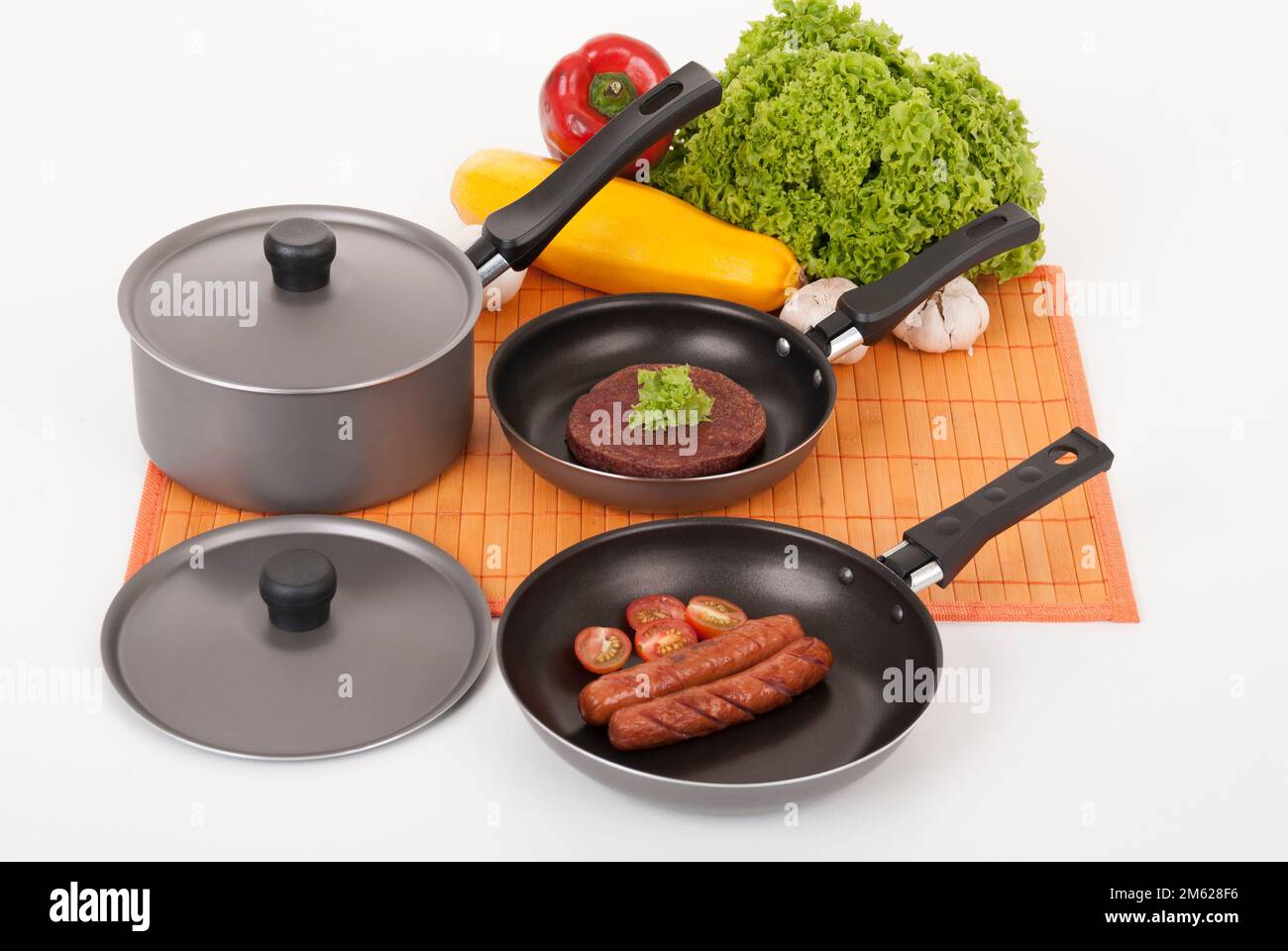 Set of pots for cooking food; photo on white background Stock Photo - Alamy