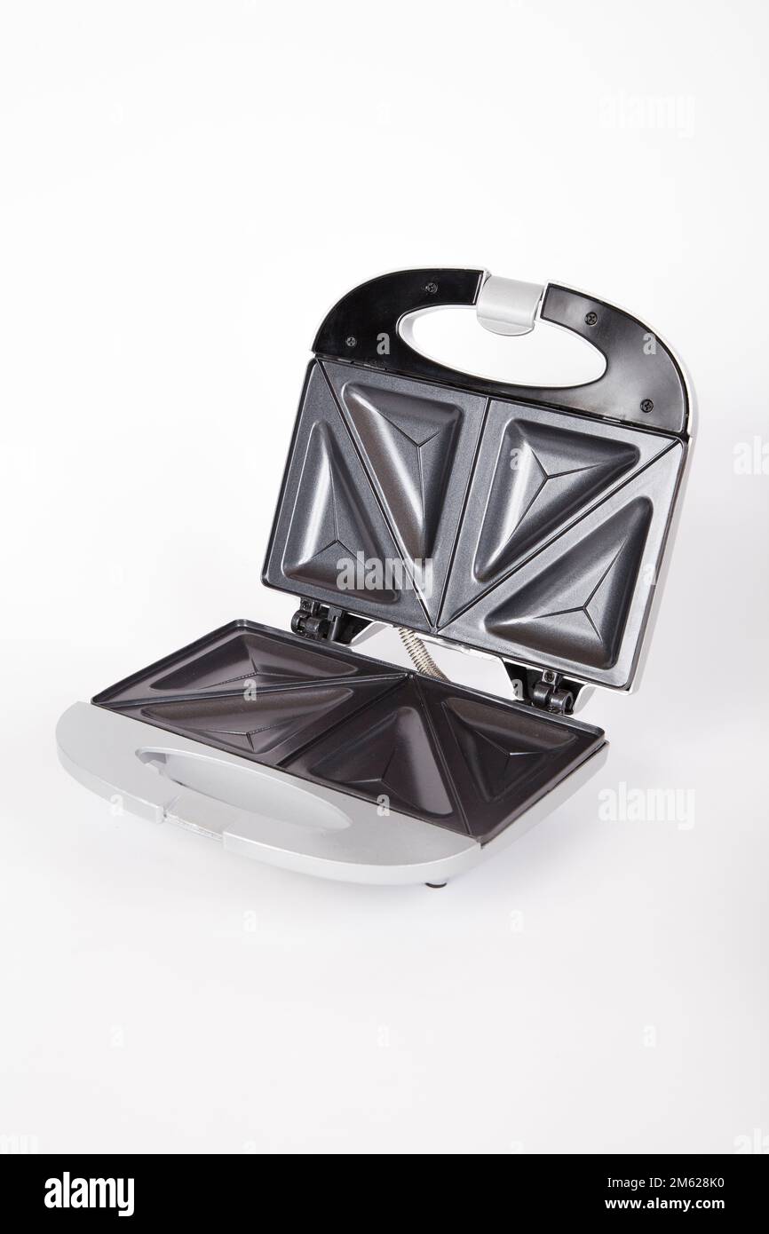 Sandwich maker gray with food; Photo on white background Stock Photo ...