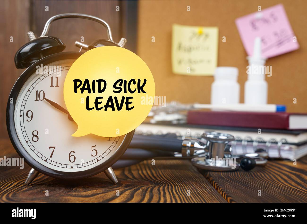 Medical concept. On the alarm clock a sticker with the inscription ...