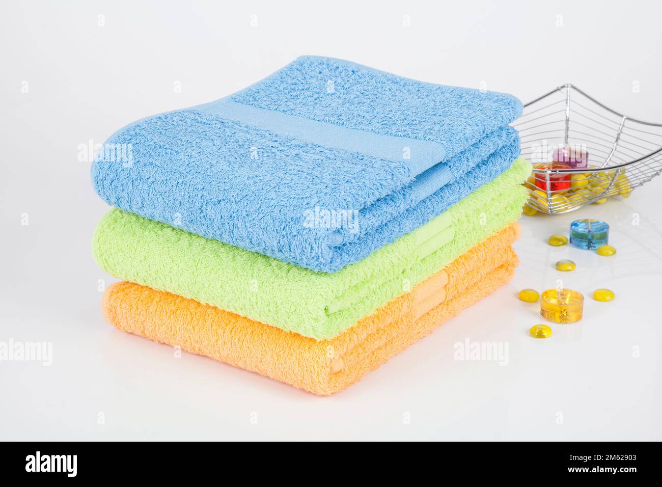 Set of three towels in different colors.; photo on white background ...
