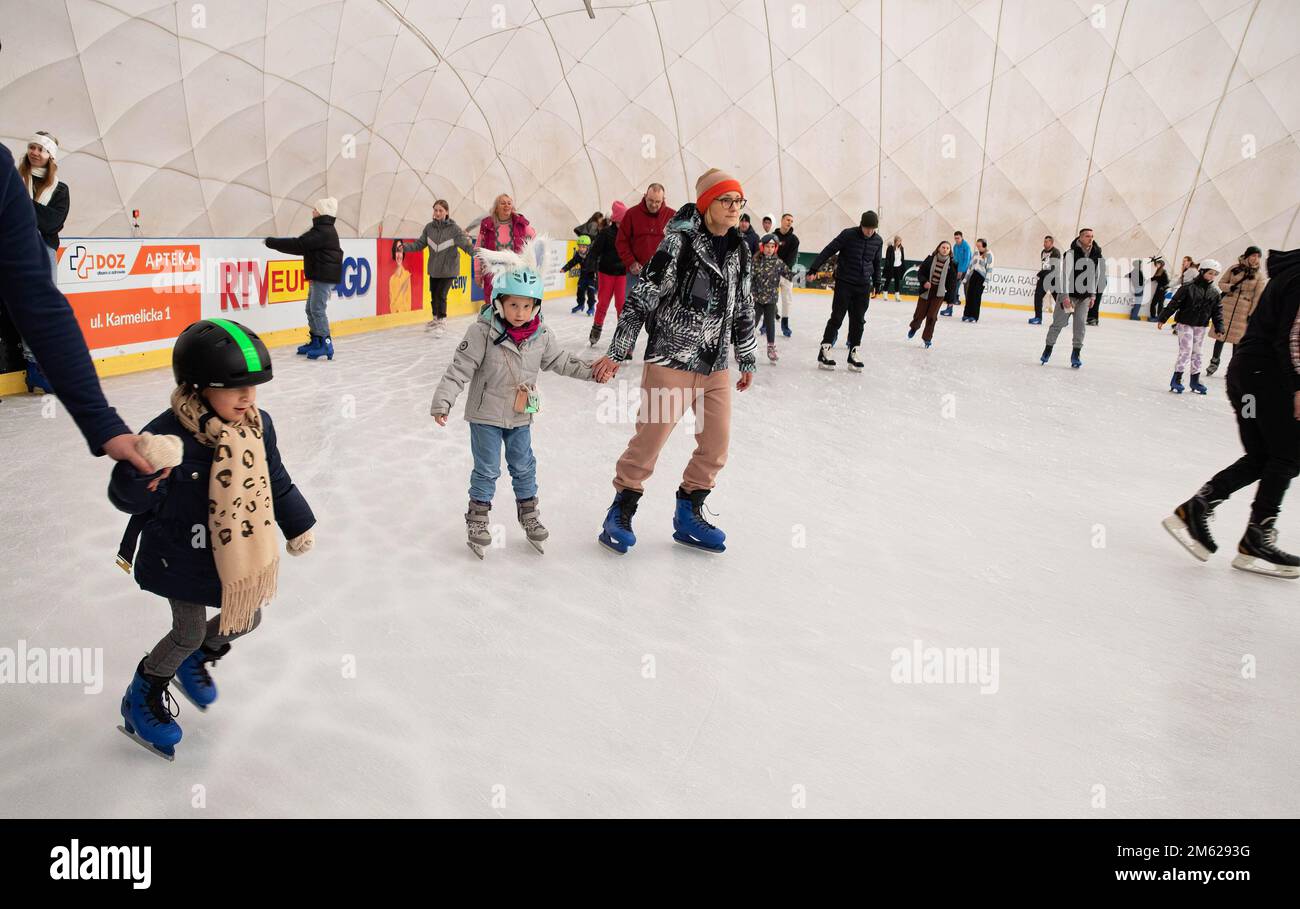 Gdansk residents and tourists are seen skating at an ice rink in Gdansk ...
