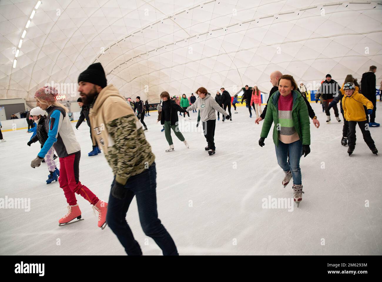 Gdansk residents and tourists are seen skating at an ice rink in Gdansk ...