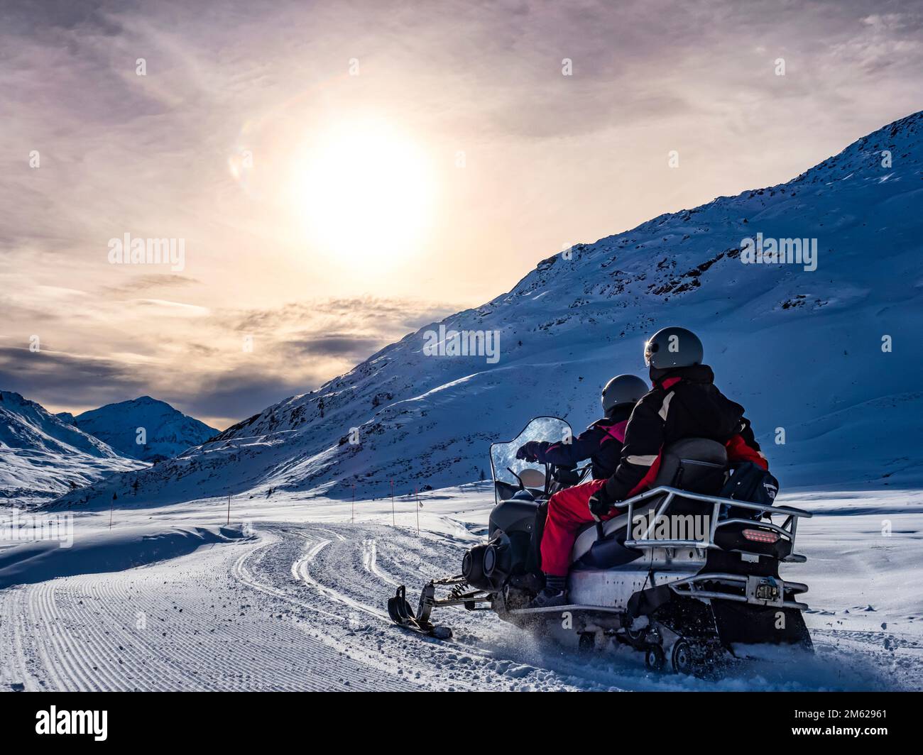 Snowmobile on a trail in the Italian alps Stock Photo - Alamy