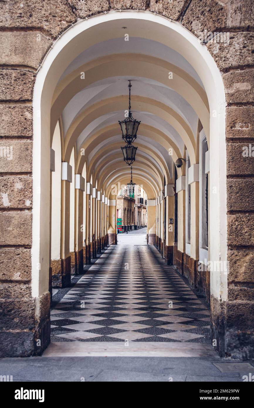A vertical shot of a corridor with arches Stock Photo - Alamy