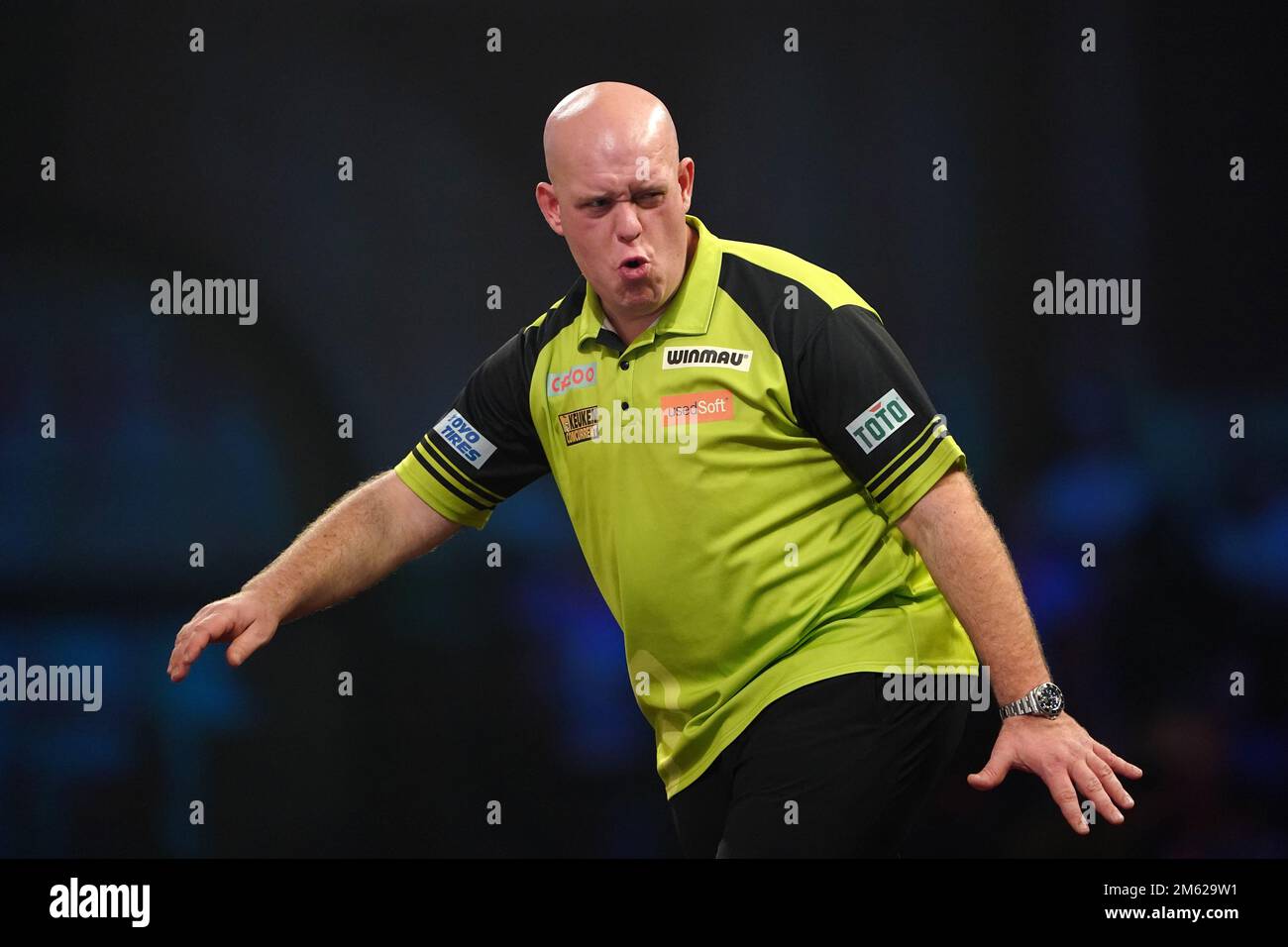 Michael van Gerwen in action against Chris Dobey during day fourteen of ...