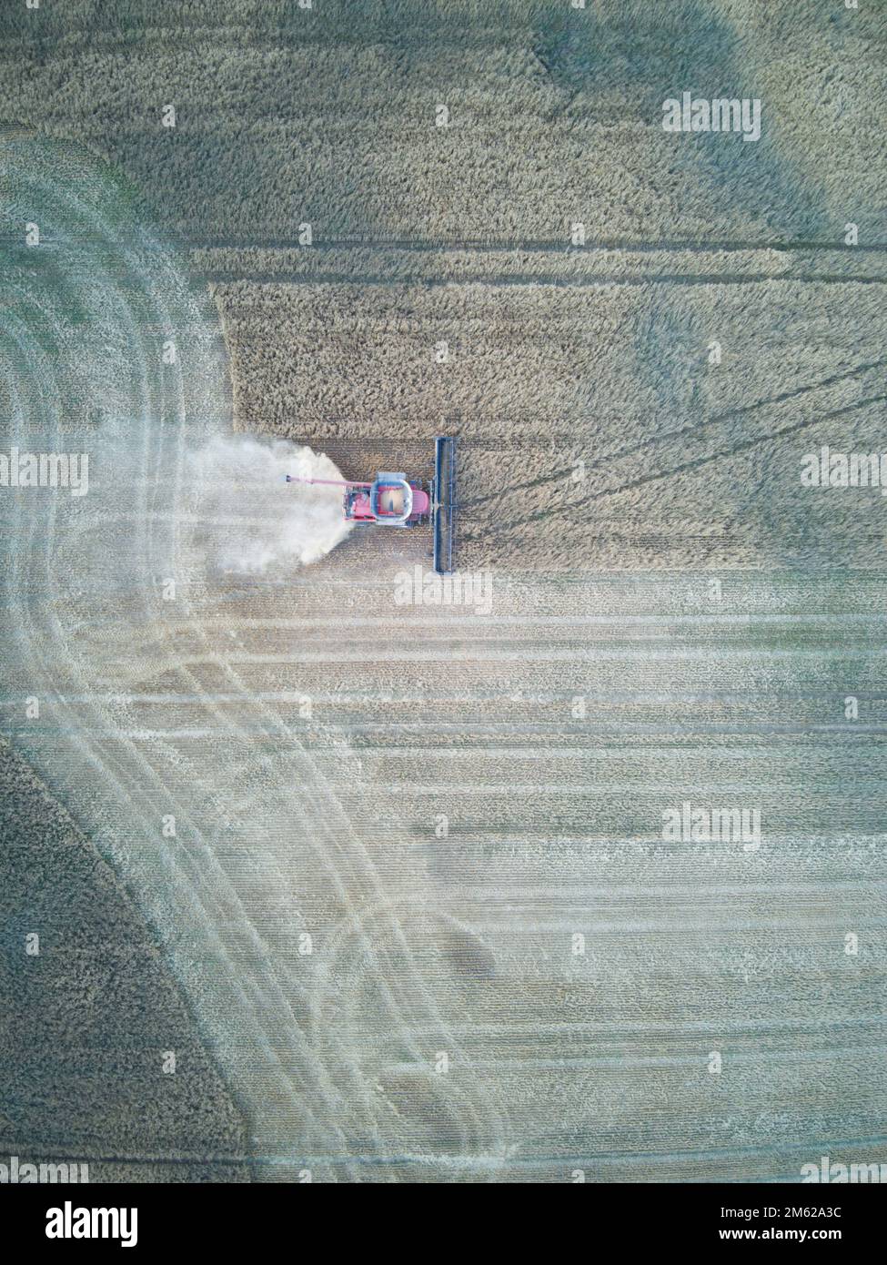 Wheat field harvester aerial view with crop marks and tracks, cutting ...