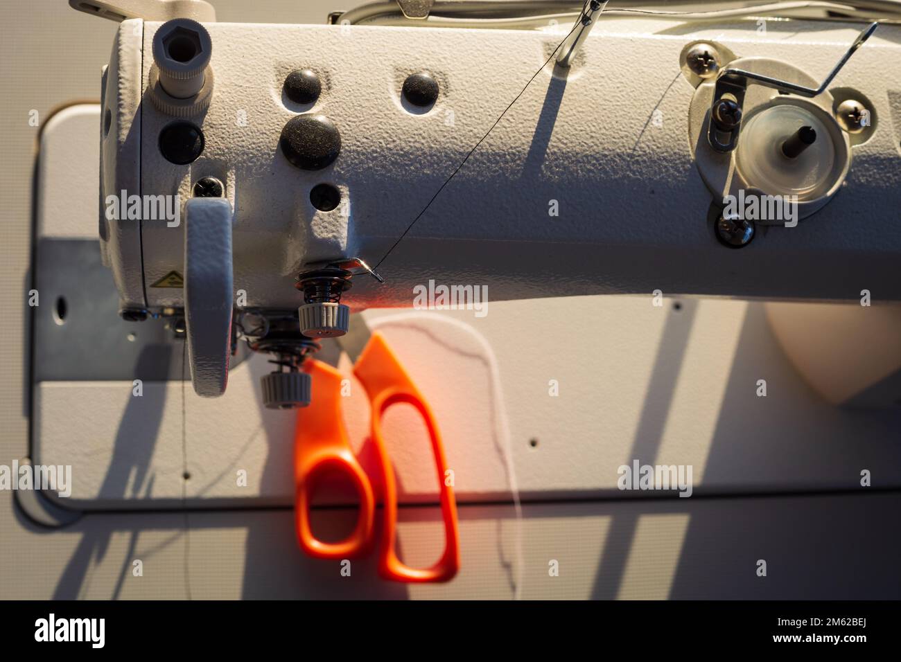 Close up of a industrial sowing machine Stock Photo - Alamy
