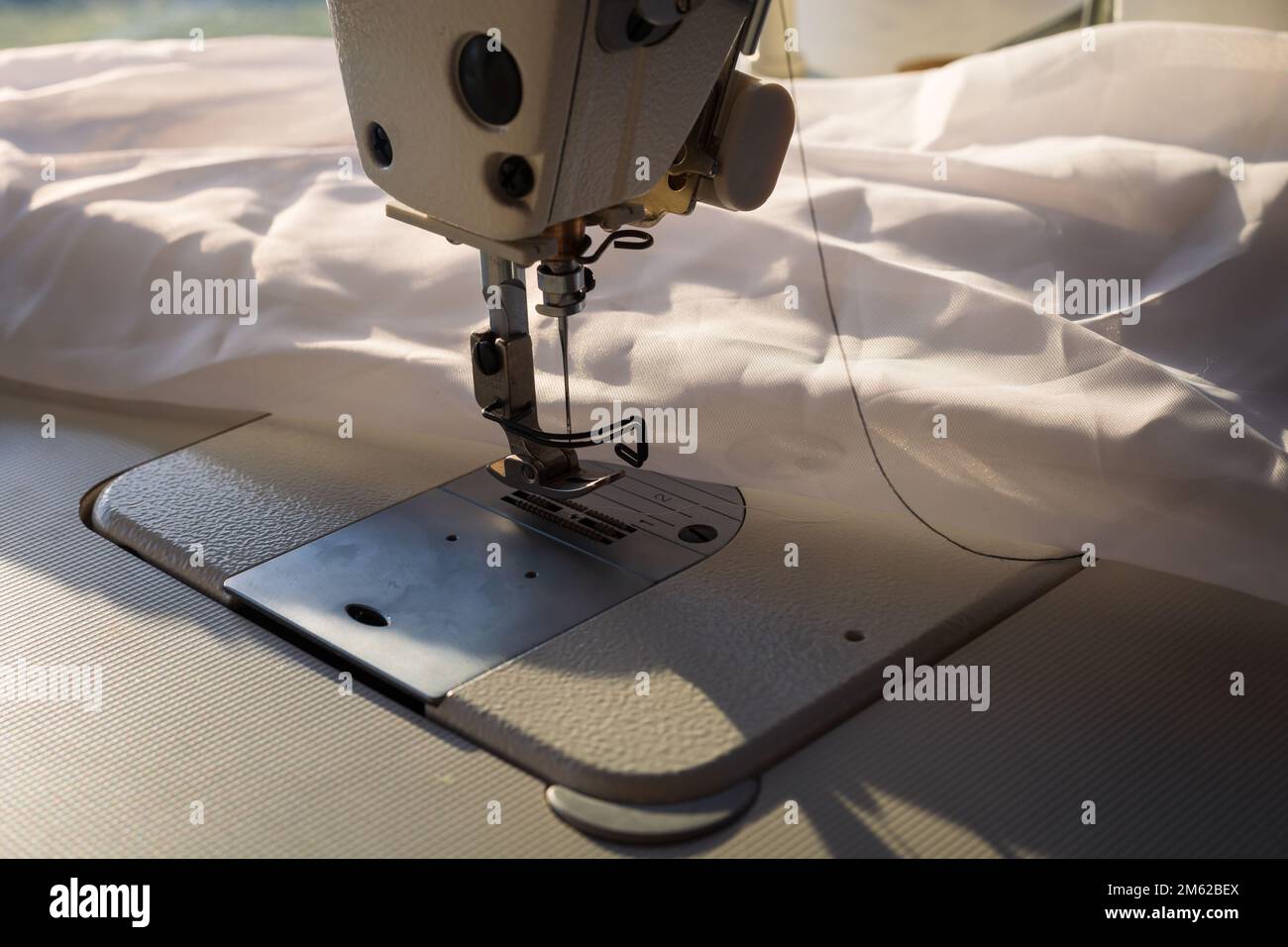 Close up of a industrial sowing machine Stock Photo - Alamy