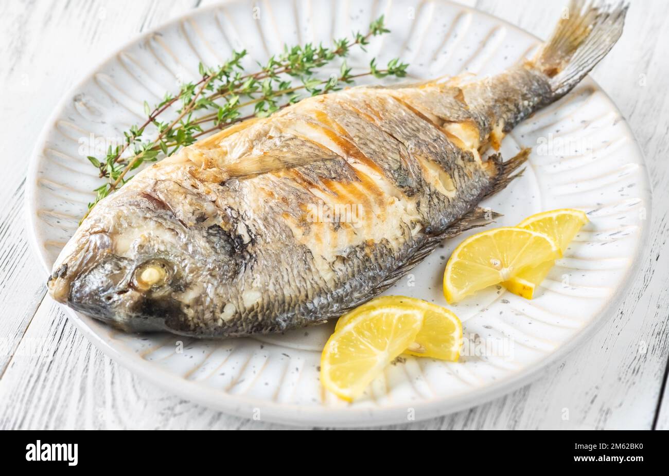 Mediterranean Baked Sea Bream Dorada fish with thyme Stock Photo - Alamy