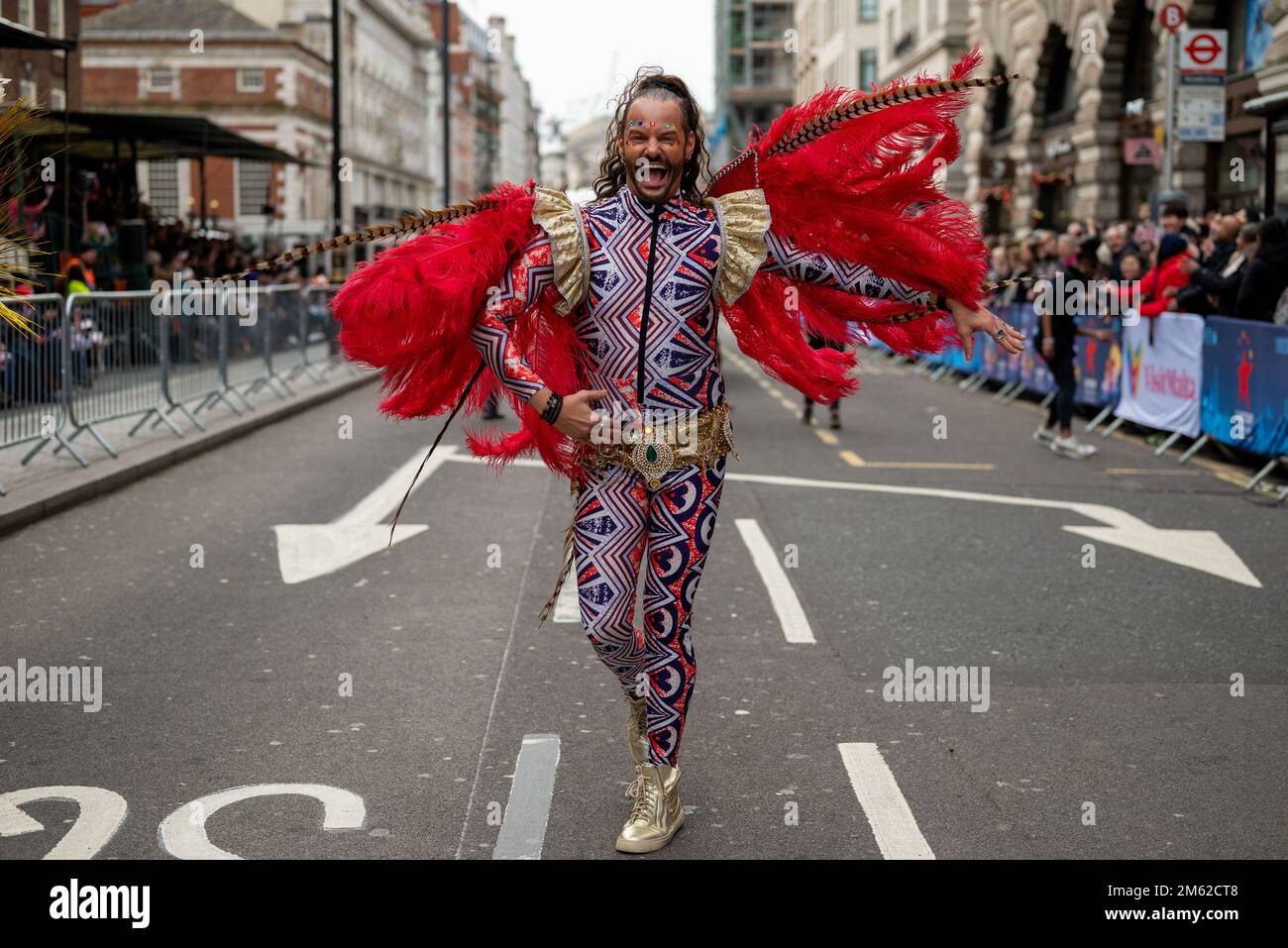London, UK. 01st Jan, 2023. A performer in colourful costume takes part ...