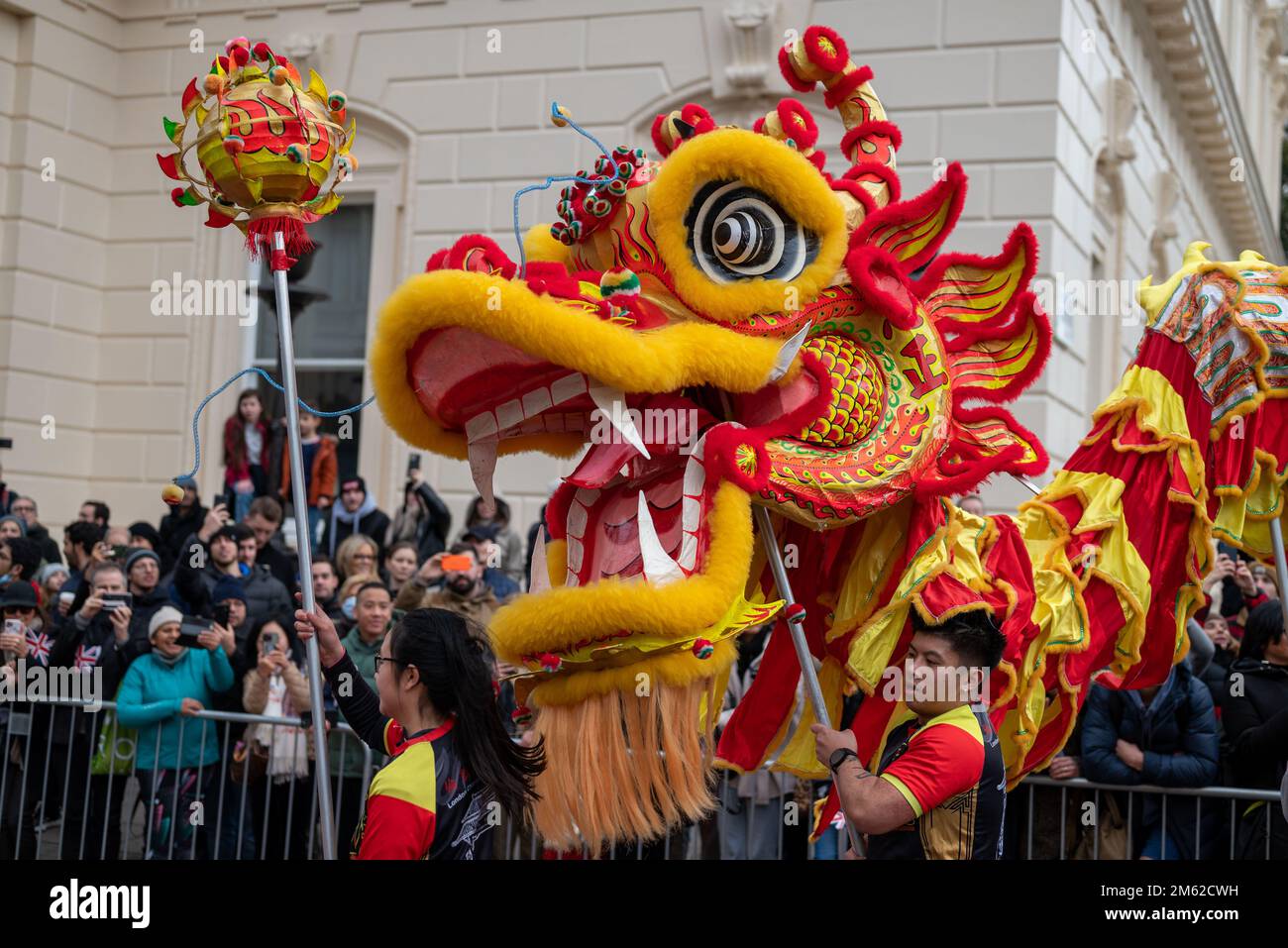 London, UK. 01st Jan, 2023. Participants carrying a Chinese dragon take part during The London ...