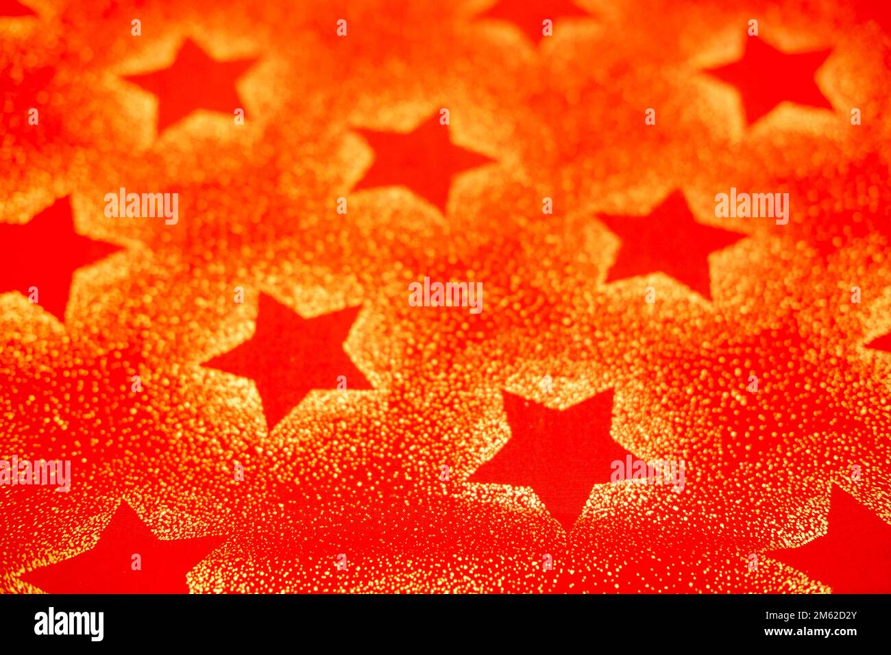 Red background with stars with sequins. christmas background fabric ...