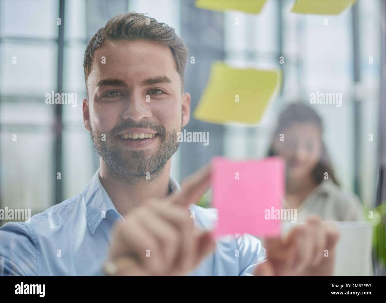 businessman is working on a project. Business man pointing at a note on ...