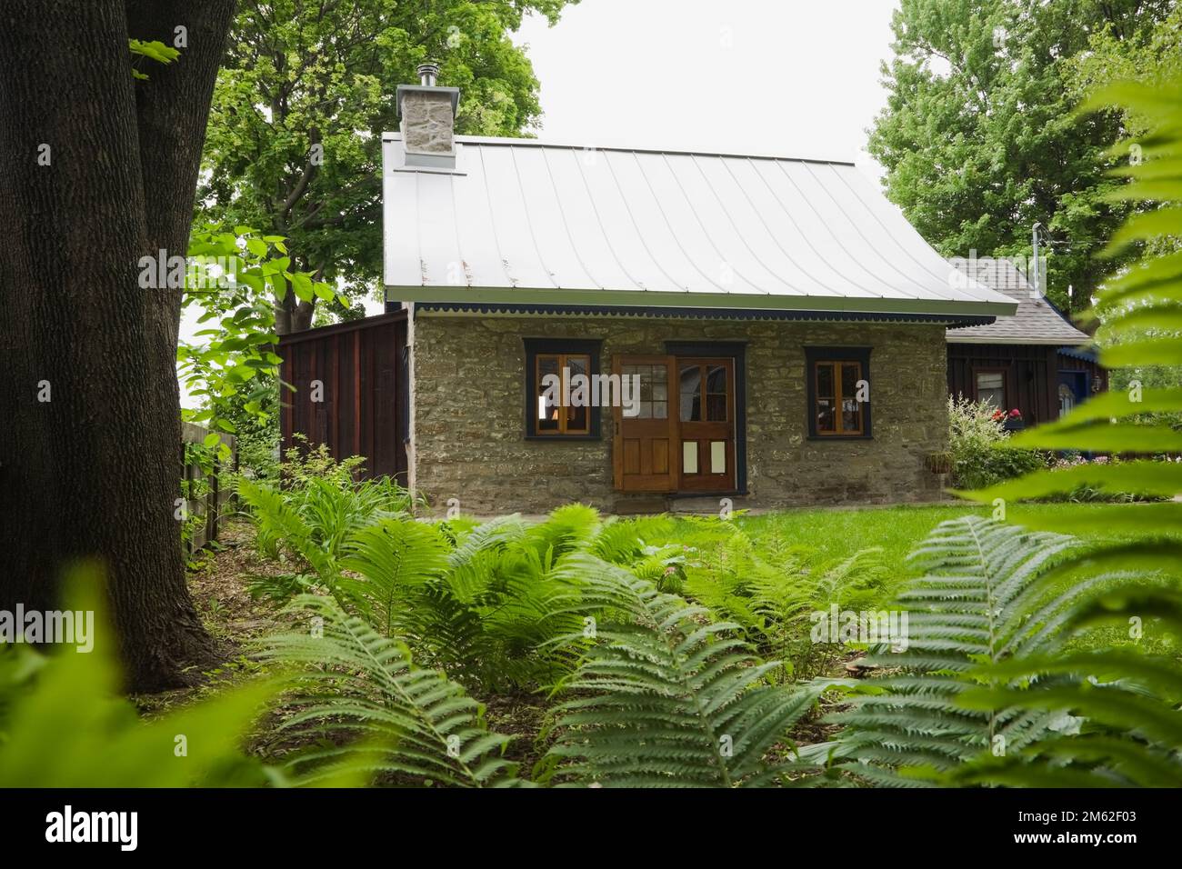 Old circa 1850 cottage style fieldstone home facade with blue trim in ...
