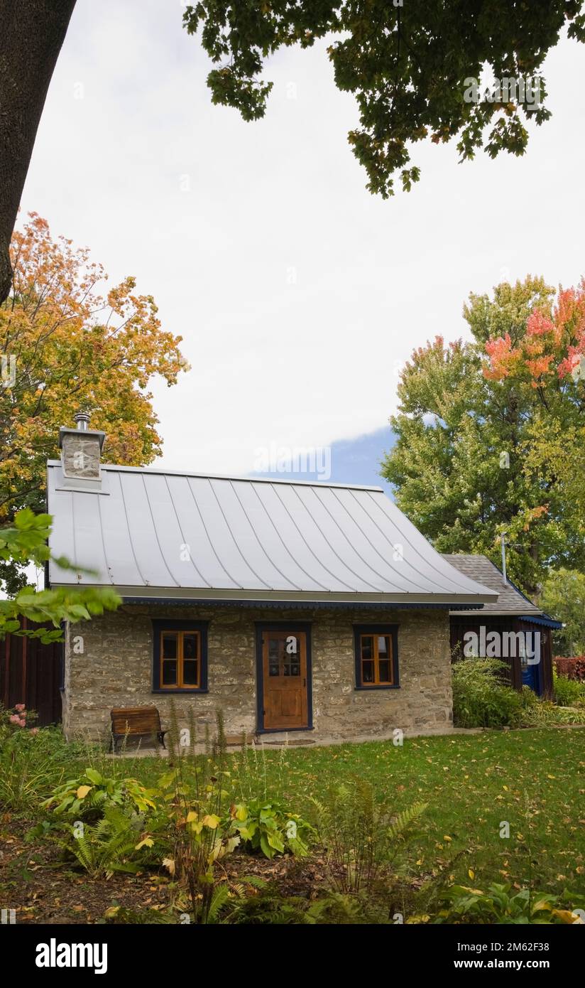 Old circa 1850 cottage style fieldstone home facade with blue trim in ...