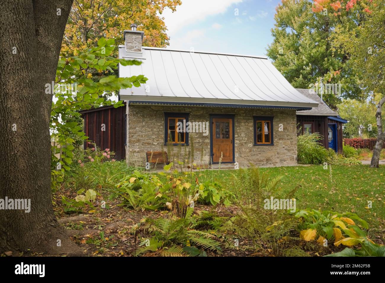 Old circa 1850 cottage style fieldstone home facade with blue trim in ...