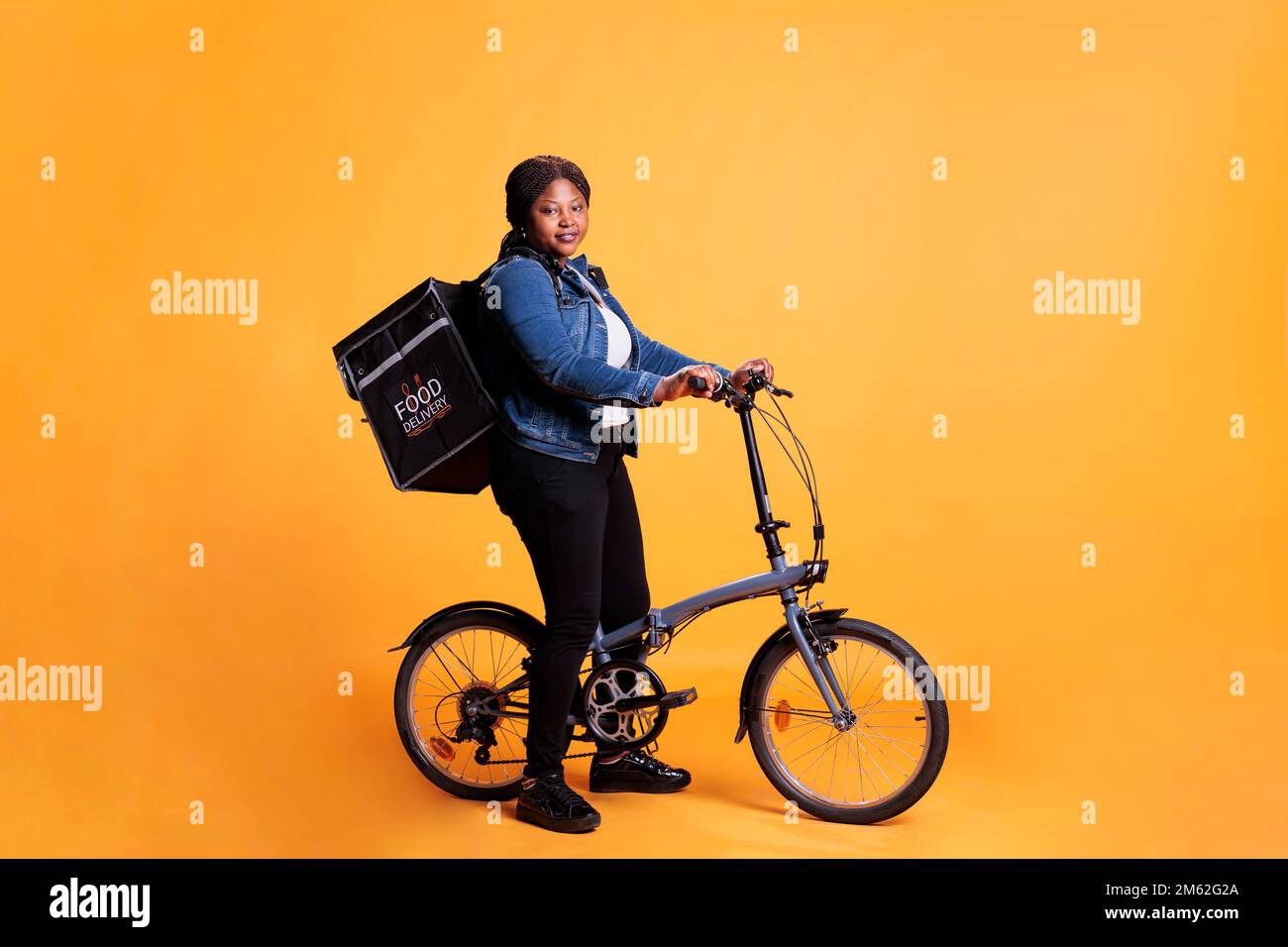 African american woman carrying food delivery thermal backpack standing ...