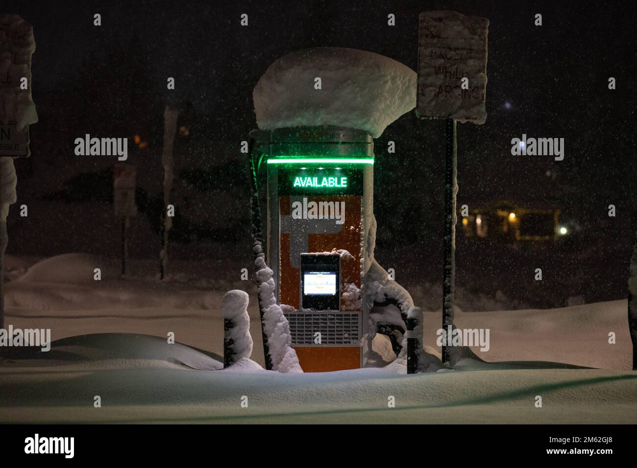 An EV charging station sits unused and buried under a deep layer of ...