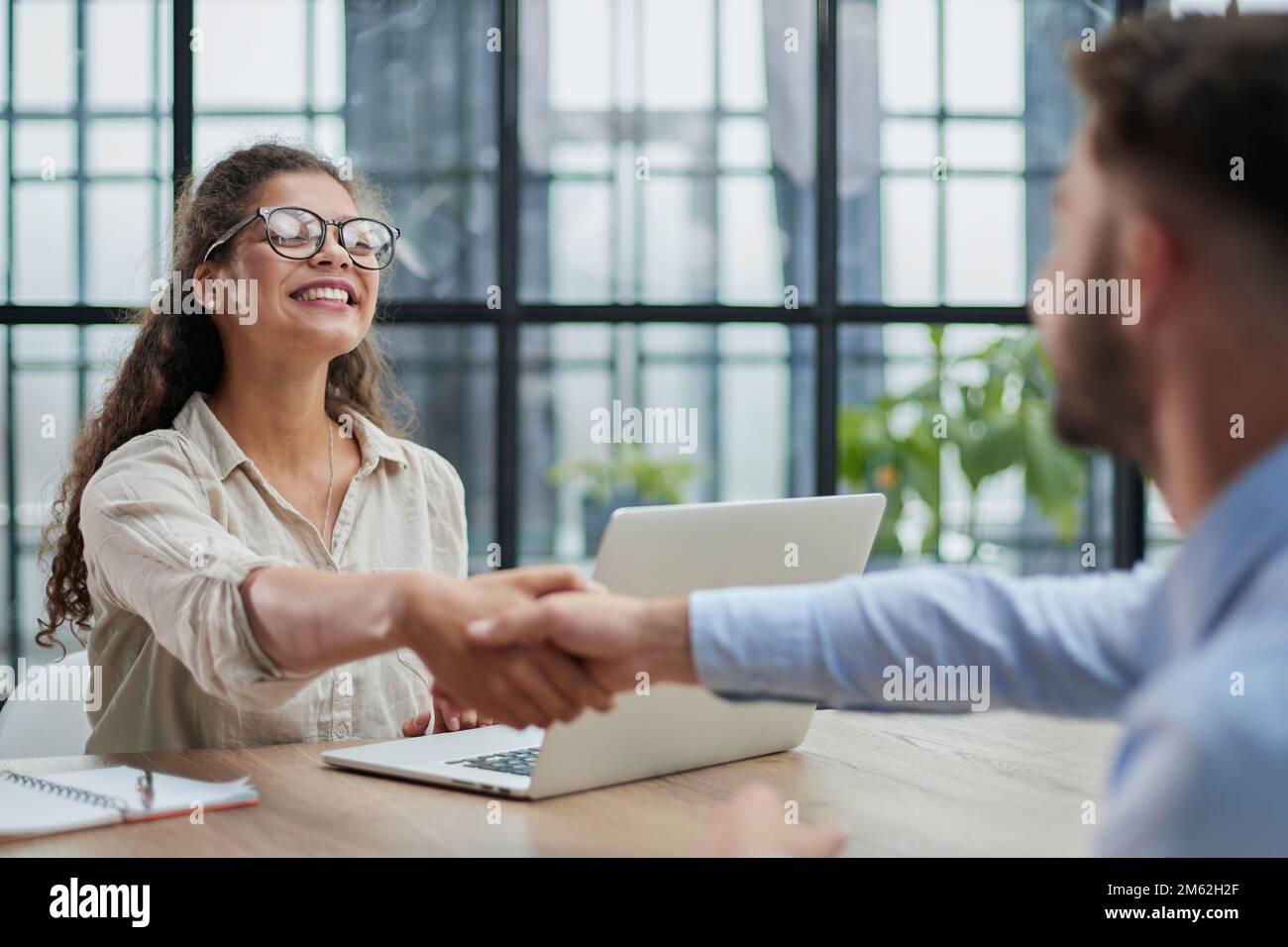 Handshake of business people sitting at the table in the office Stock ...