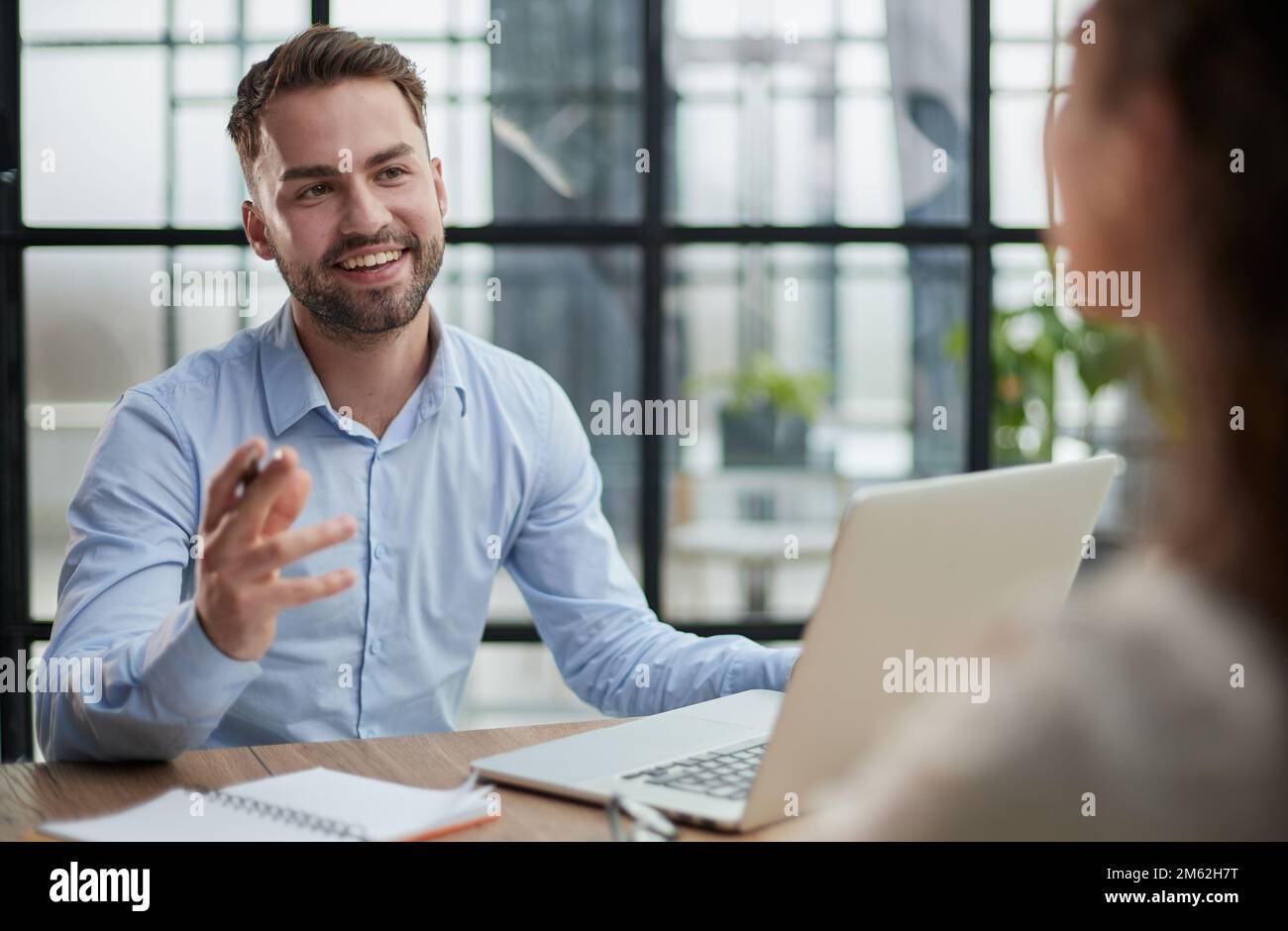 business man sitting at his desk in the office Stock Photo - Alamy