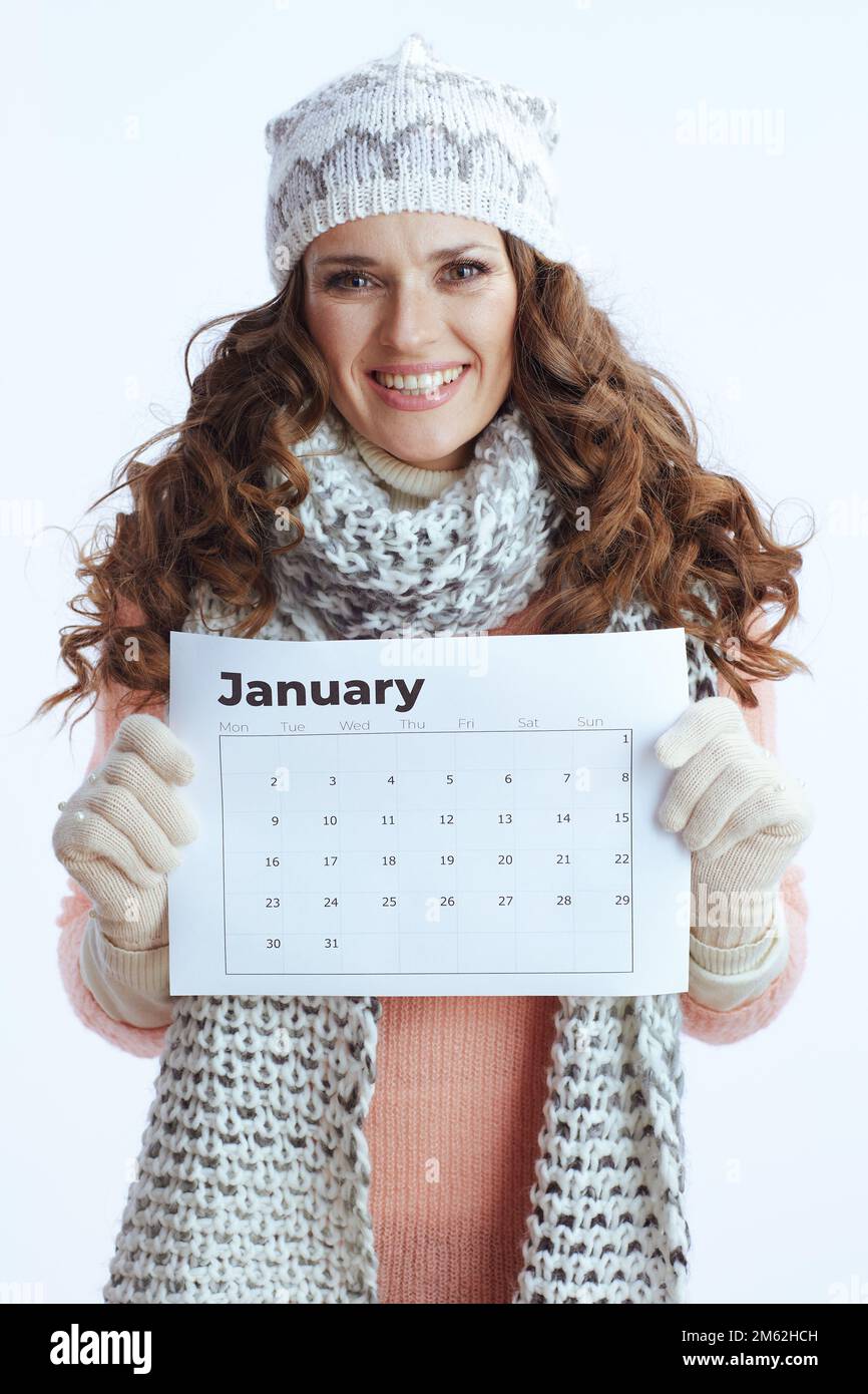 Hello winter. happy stylish woman in sweater, mittens, hat and scarf ...