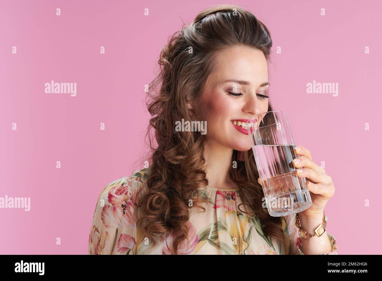 happy trendy 40 years old woman with long wavy brunette hair with glass ...