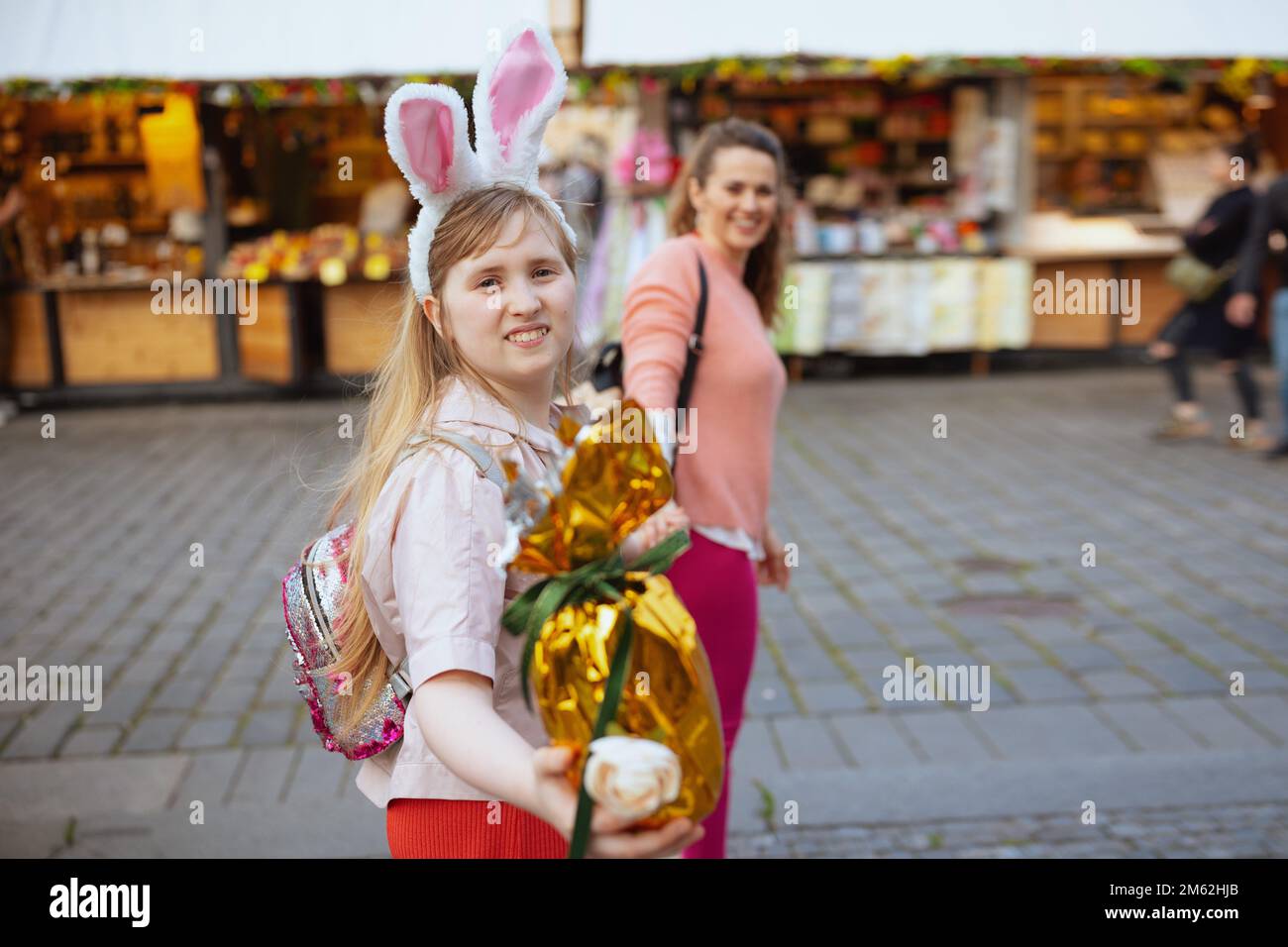 Easter fun. smiling young mother and teenage daughter with golden ...