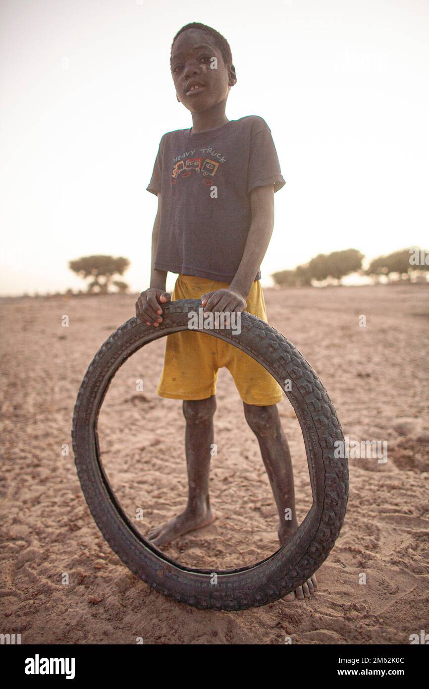 African child playing with a wheel ,Mali, West Africa Stock Photo - Alamy
