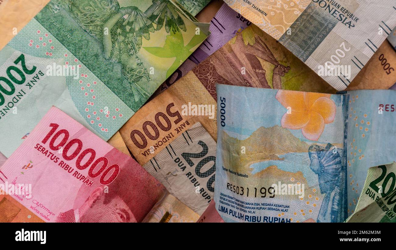 pile of rupiah banknotes as background Stock Photo - Alamy