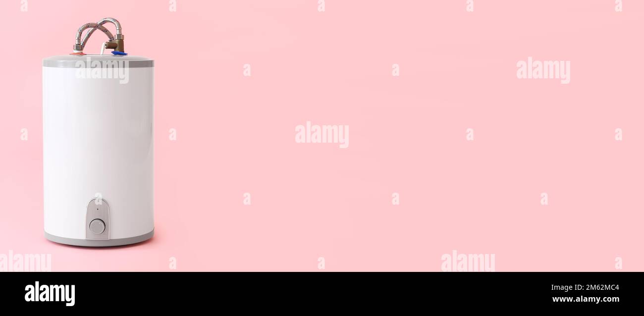 Modern electric boiler on pink background with space for text Stock ...