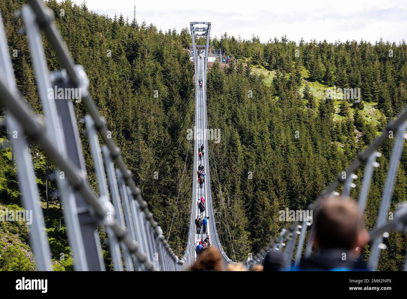 Tourists cross the world's longest suspension footbridge; Sky Bridge ...