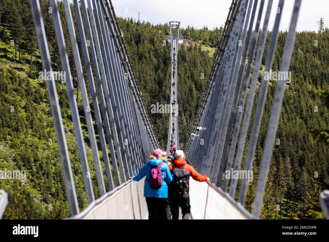 Tourists cross the world's longest suspension footbridge; Sky Bridge ...