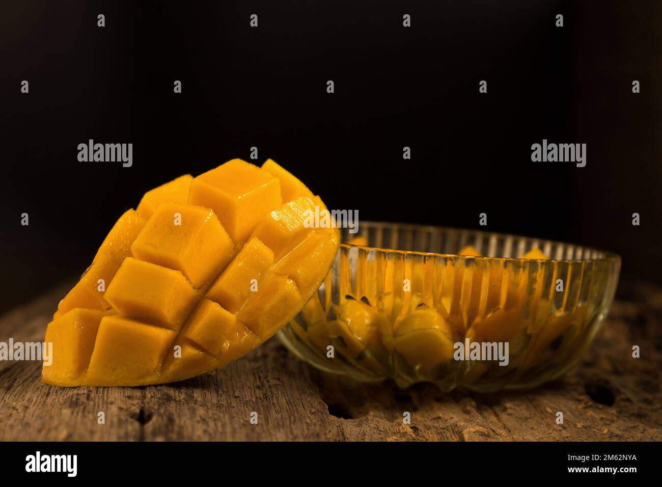 mango on a dark wood background Stock Photo - Alamy