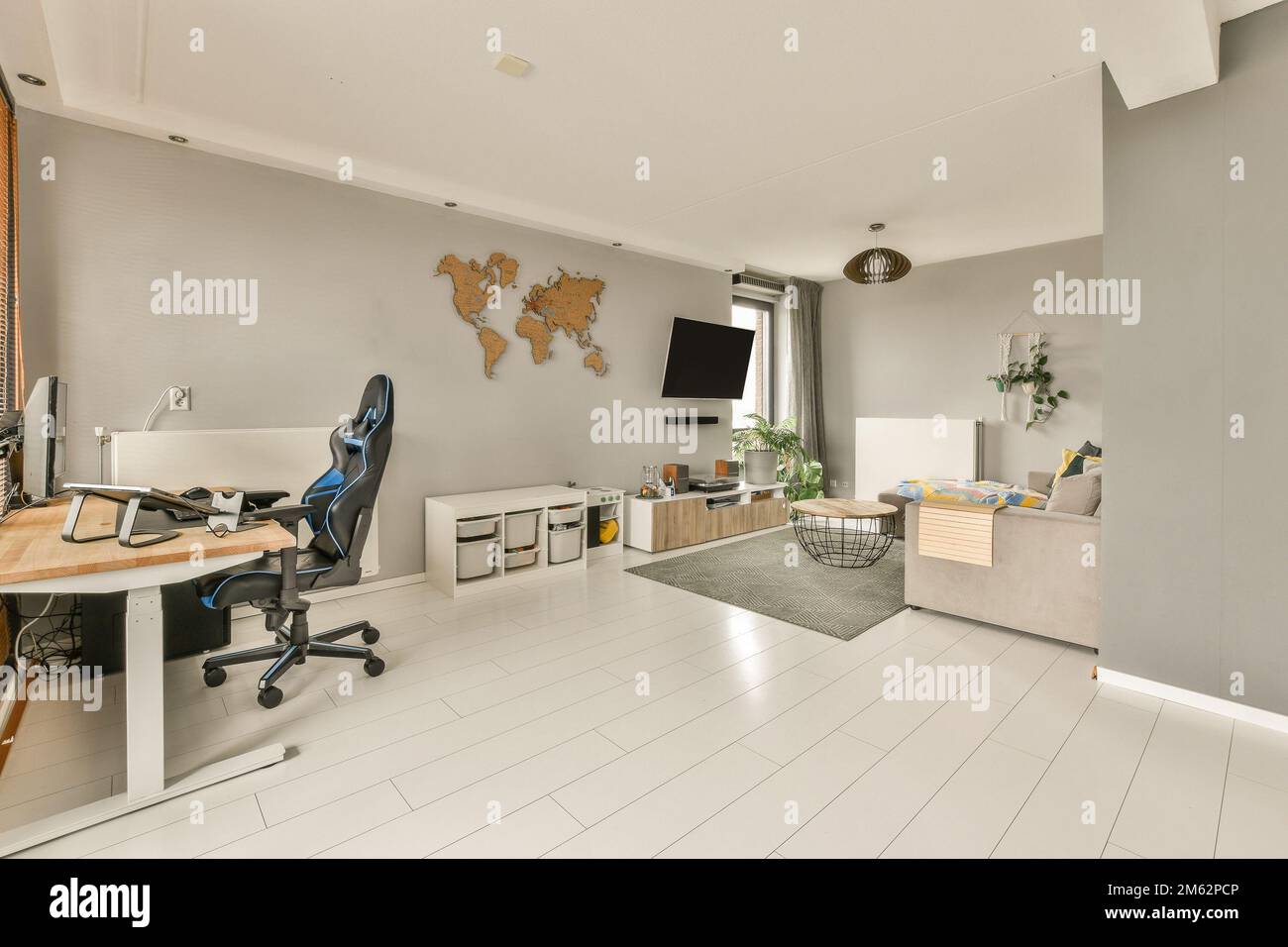 an office space with desks, chairs and a large map on the wall in the ...