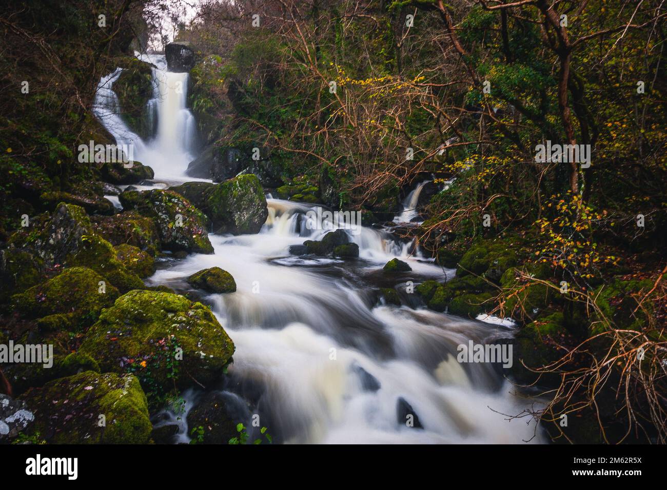 Waterfall falling from beautiful green Wicklow mountains Devil Glen ...