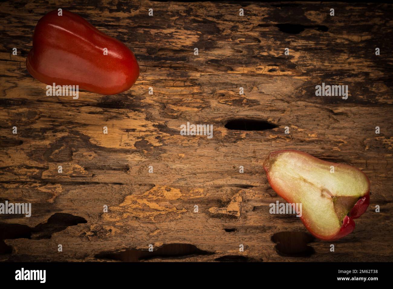 rose apple on wood. dark. night Stock Photo - Alamy