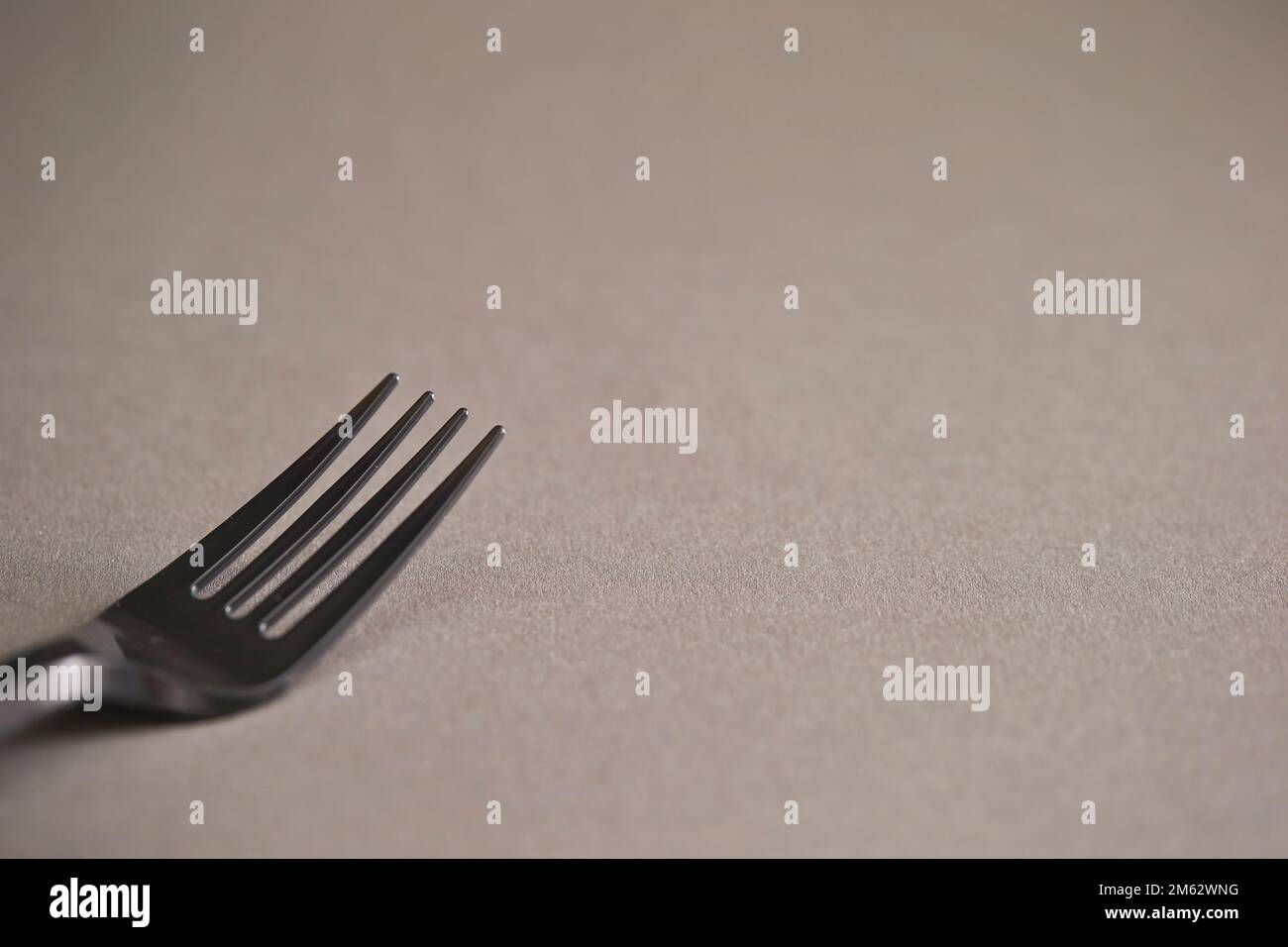 black fork on gray background Stock Photo - Alamy