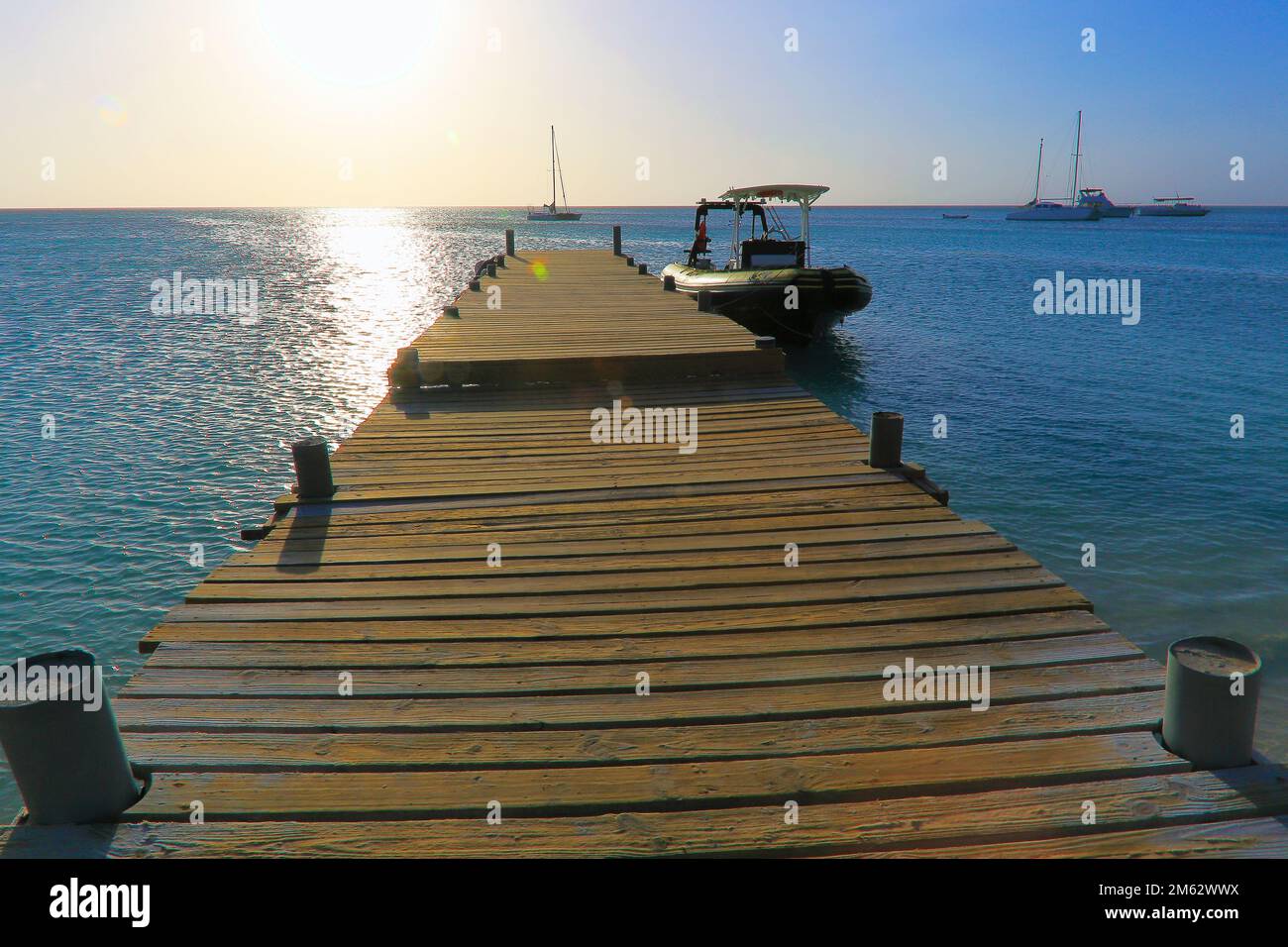 Pier on turquoise beach in Aruba at sunset, Caribbean Blue sea, Duth ...
