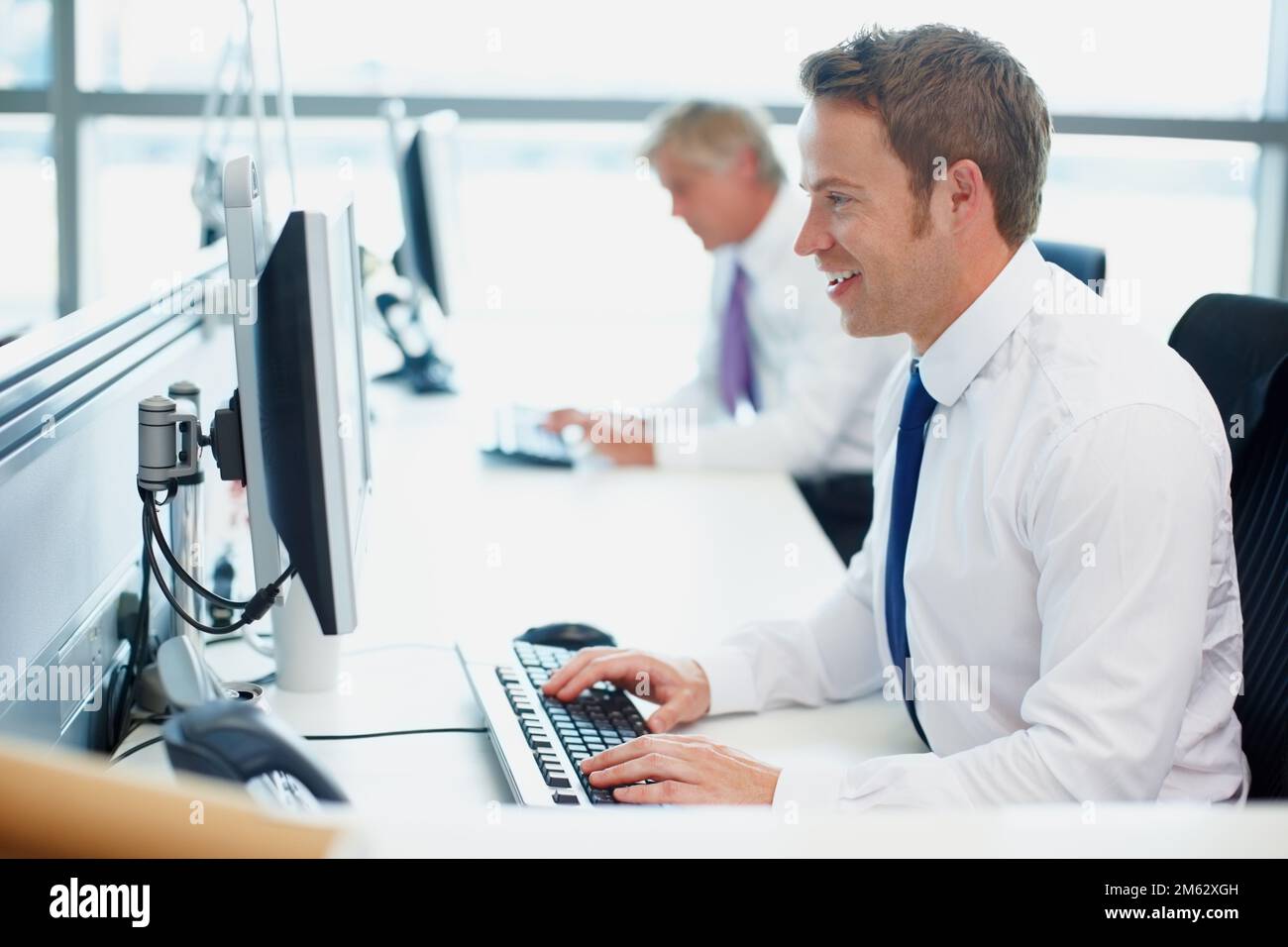 Business man using computer. Portrait of handsome business man using ...